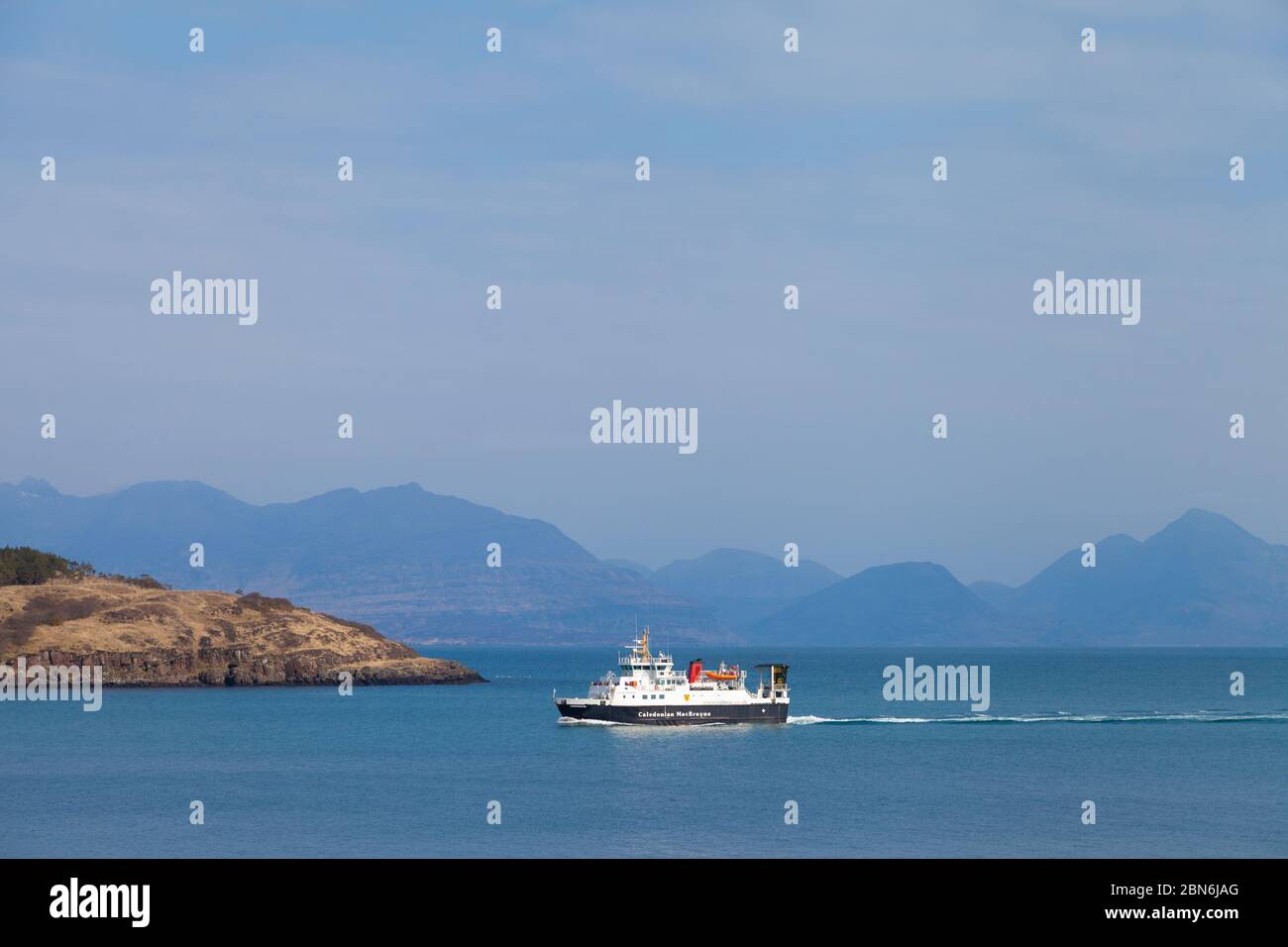A small Caledonian MacBrayne ferry arriving into Loch Scresort on the ...