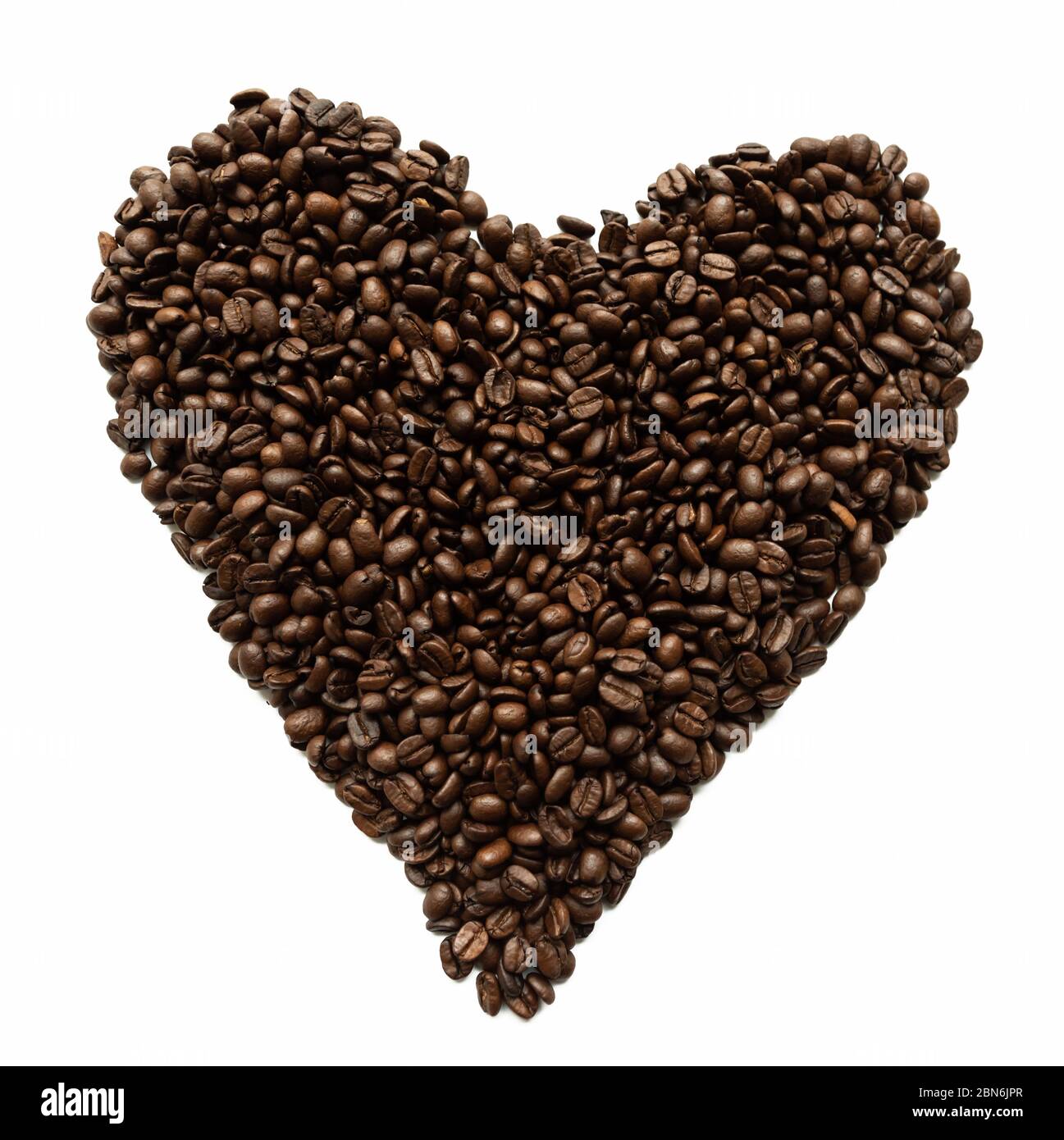 Coffee beans lying on white isolated background Stock Photo - Alamy