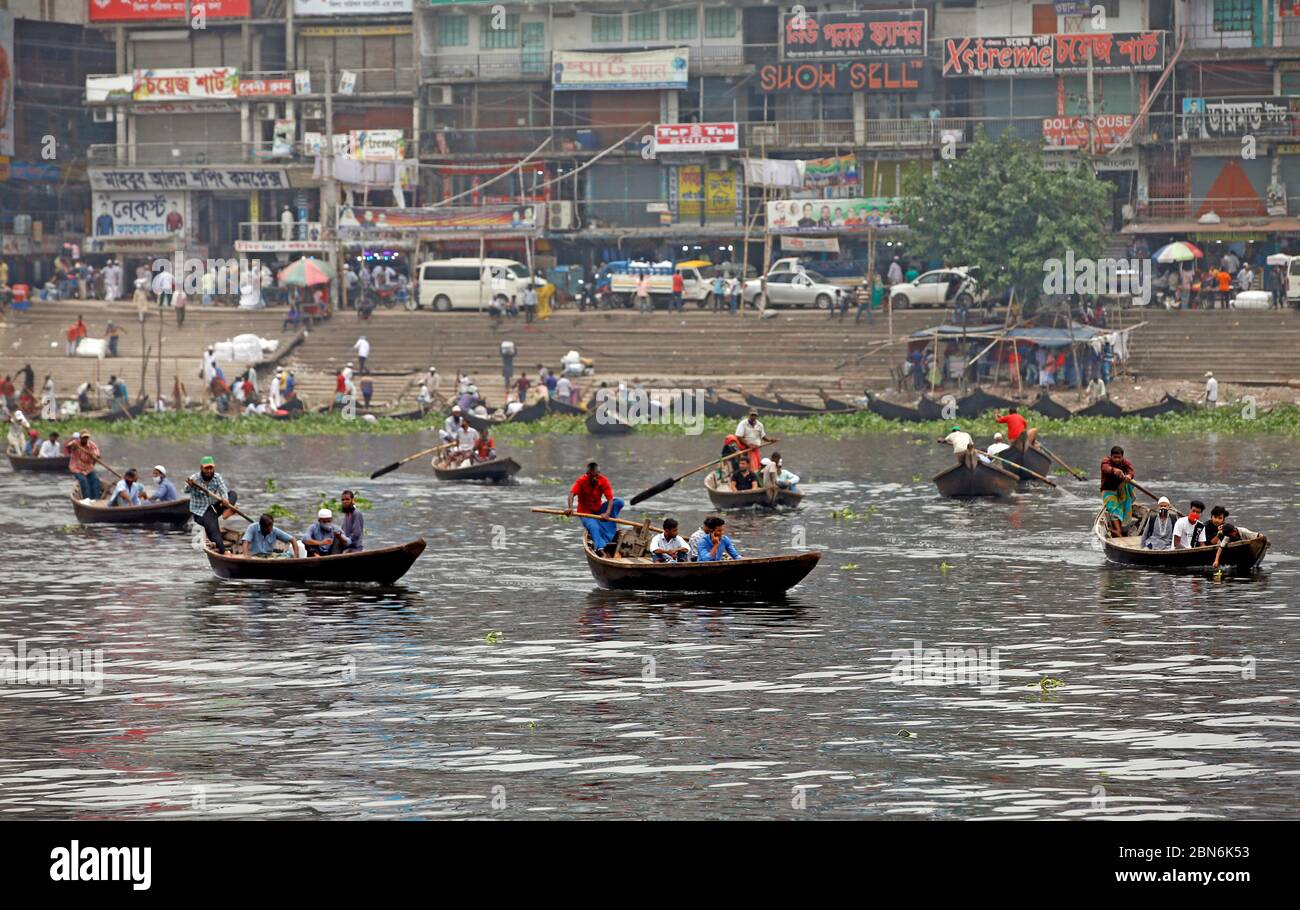 Even though boats, carrying people, gliding gently over the Buriganga ...