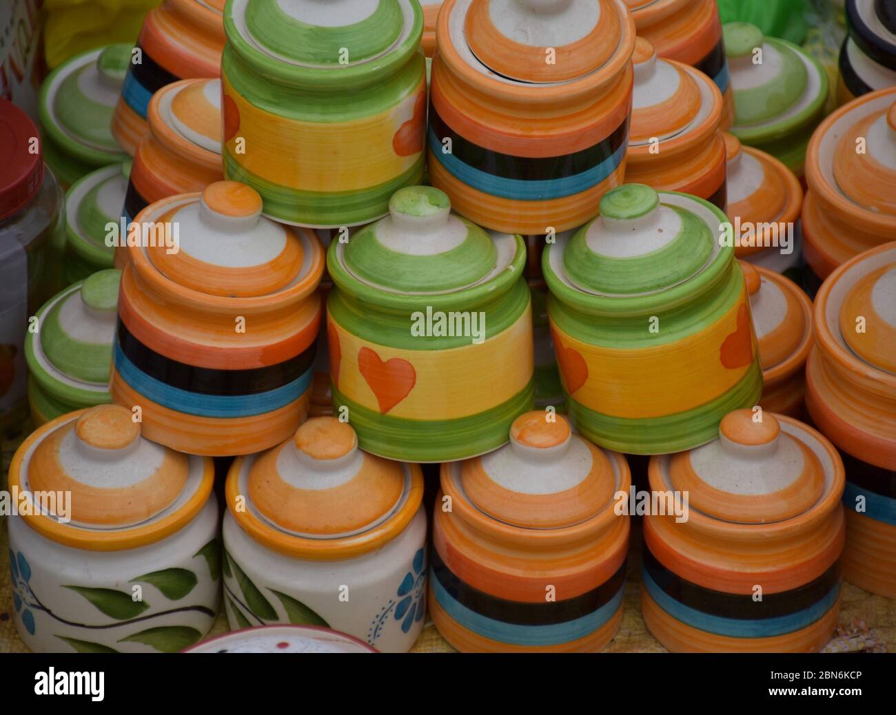 Colored designer handicraft jars in the market Stock Photo - Alamy