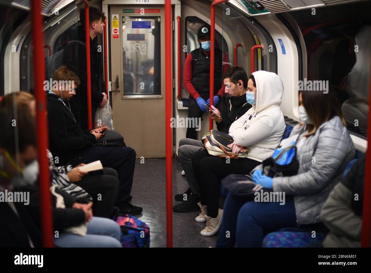Passengers wear face masks on a Central Line underground train in ...