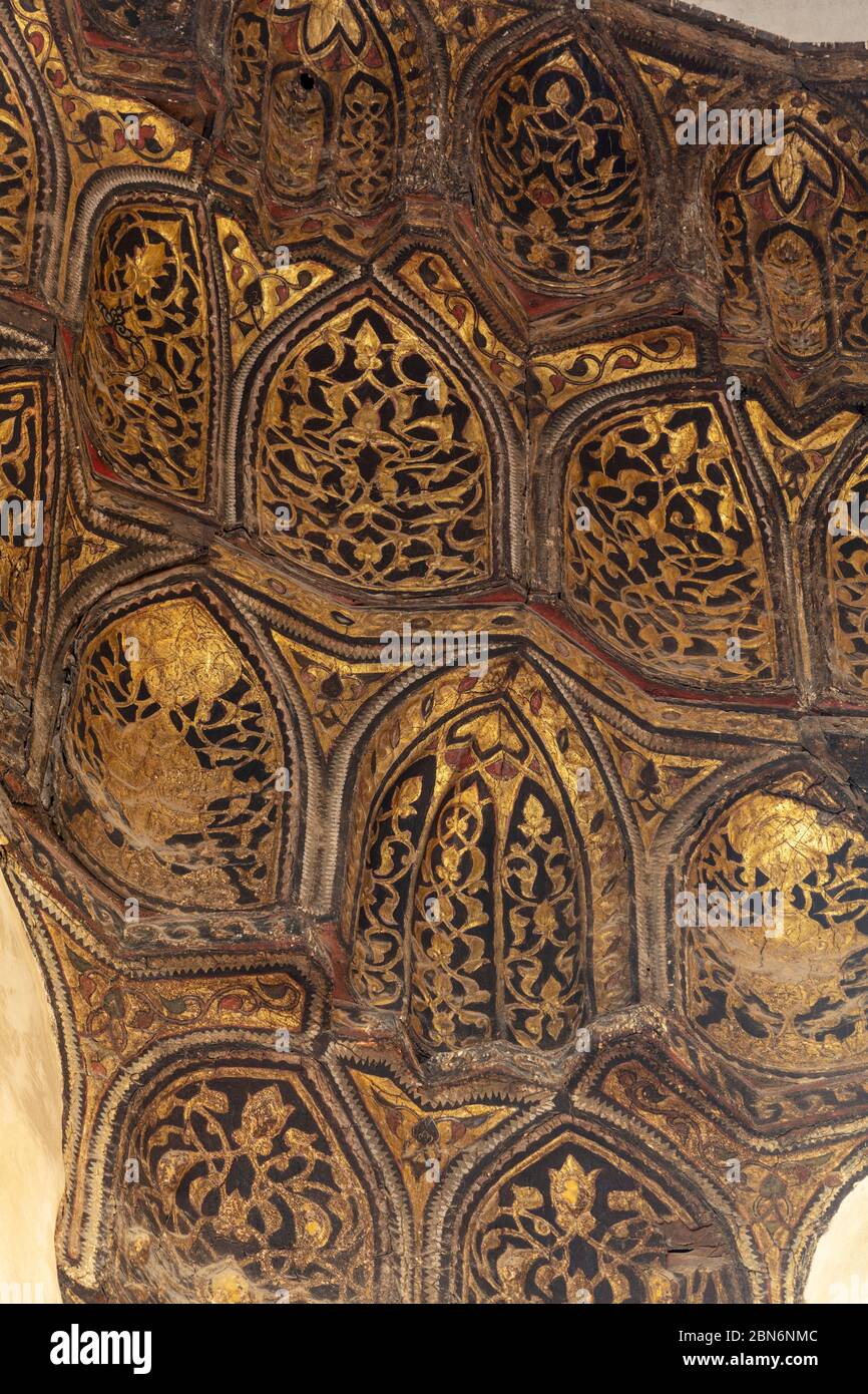 detail of painting of arabesques in the muqarnas of the dome of the ...