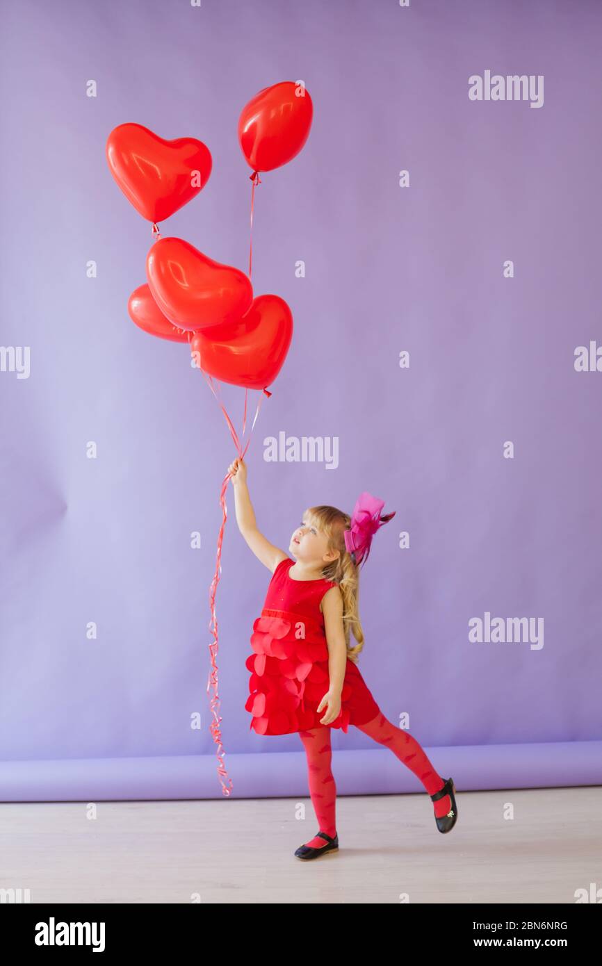 Girl run red balloon hi-res stock photography and images - Alamy