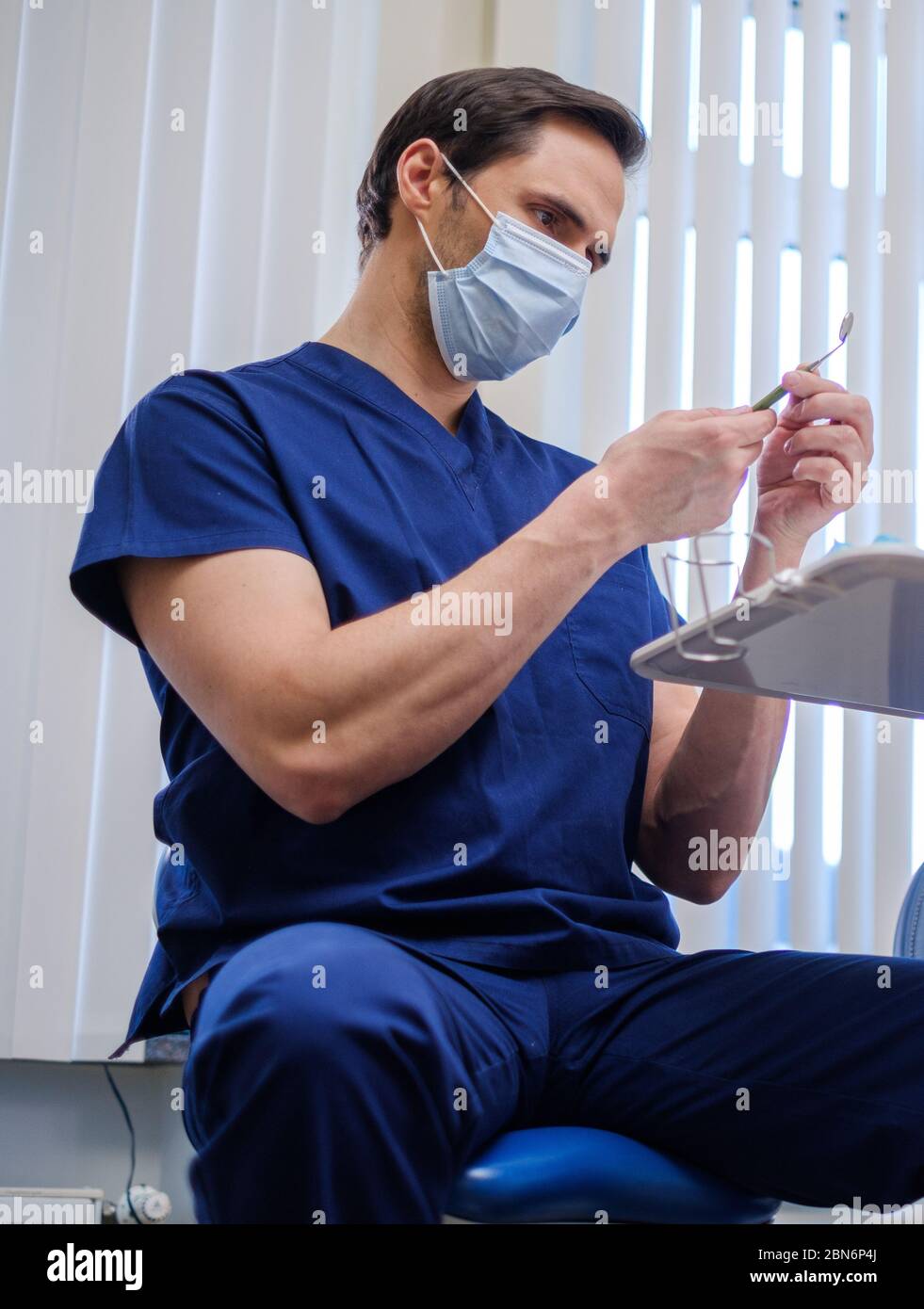 Doctor wearing protective mask in a hospital Stock Photo - Alamy