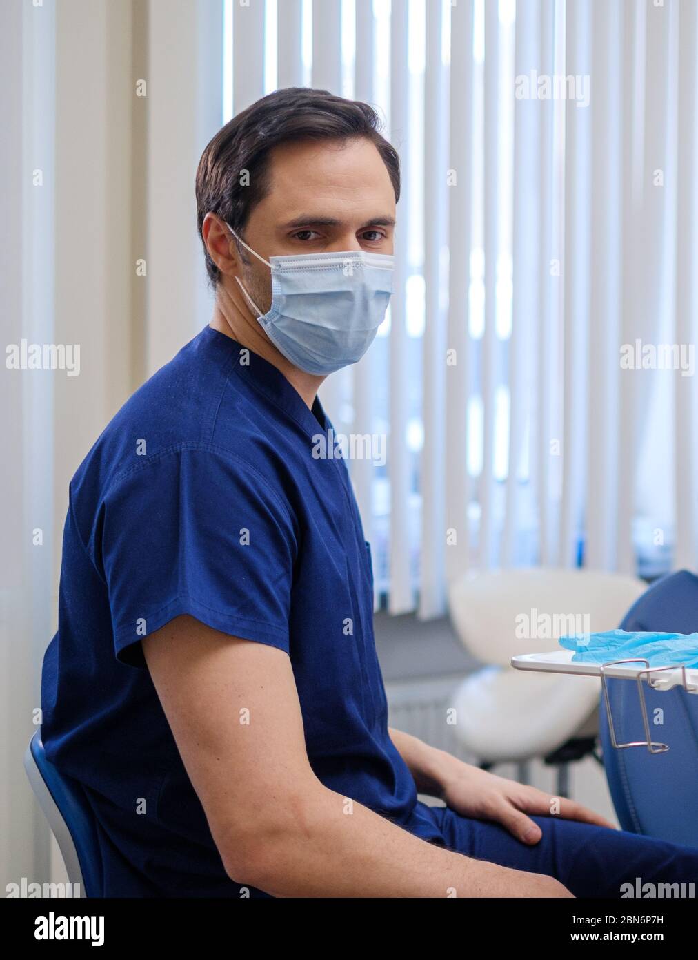 Doctor wearing protective mask in a hospital Stock Photo - Alamy