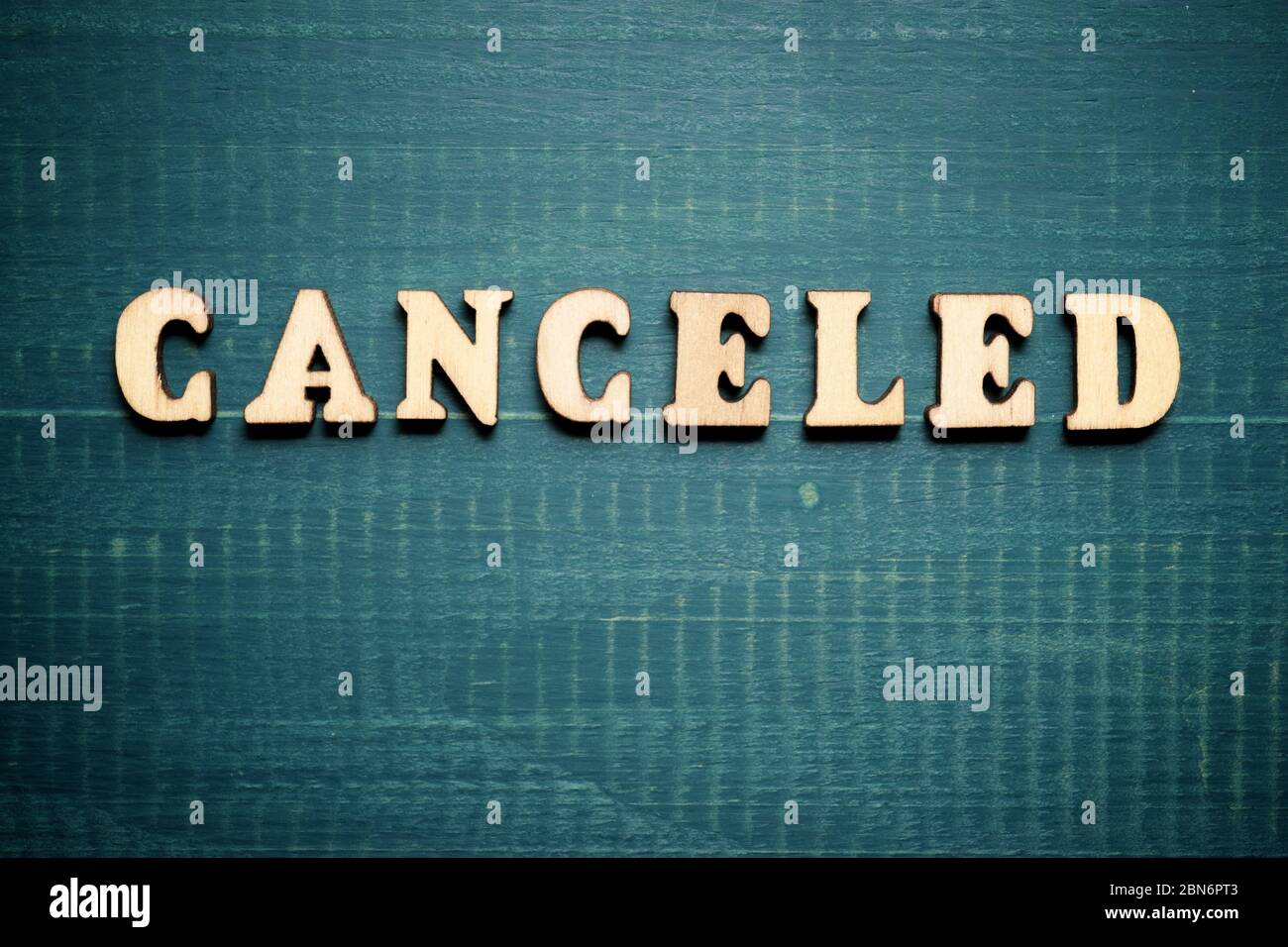 Canceled word on a wood table Stock Photo - Alamy