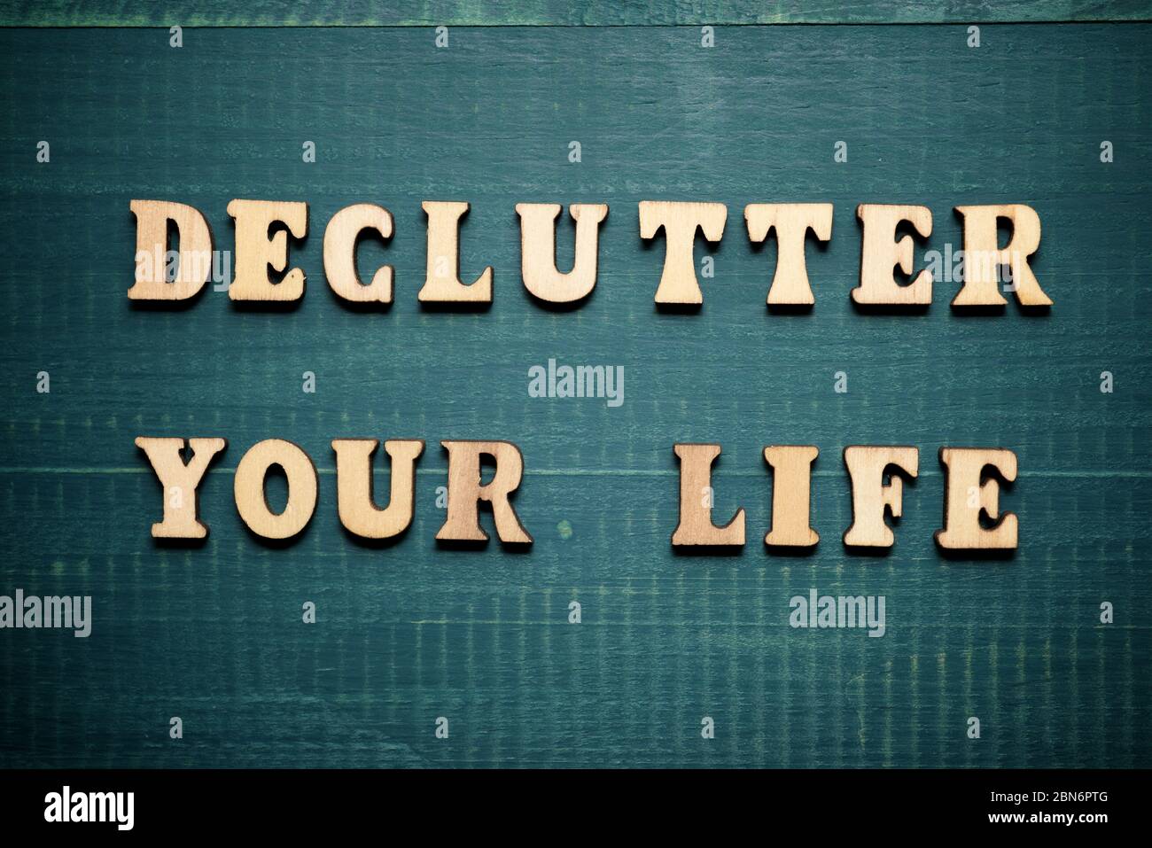 Declutter your life text on a wood table Stock Photo - Alamy
