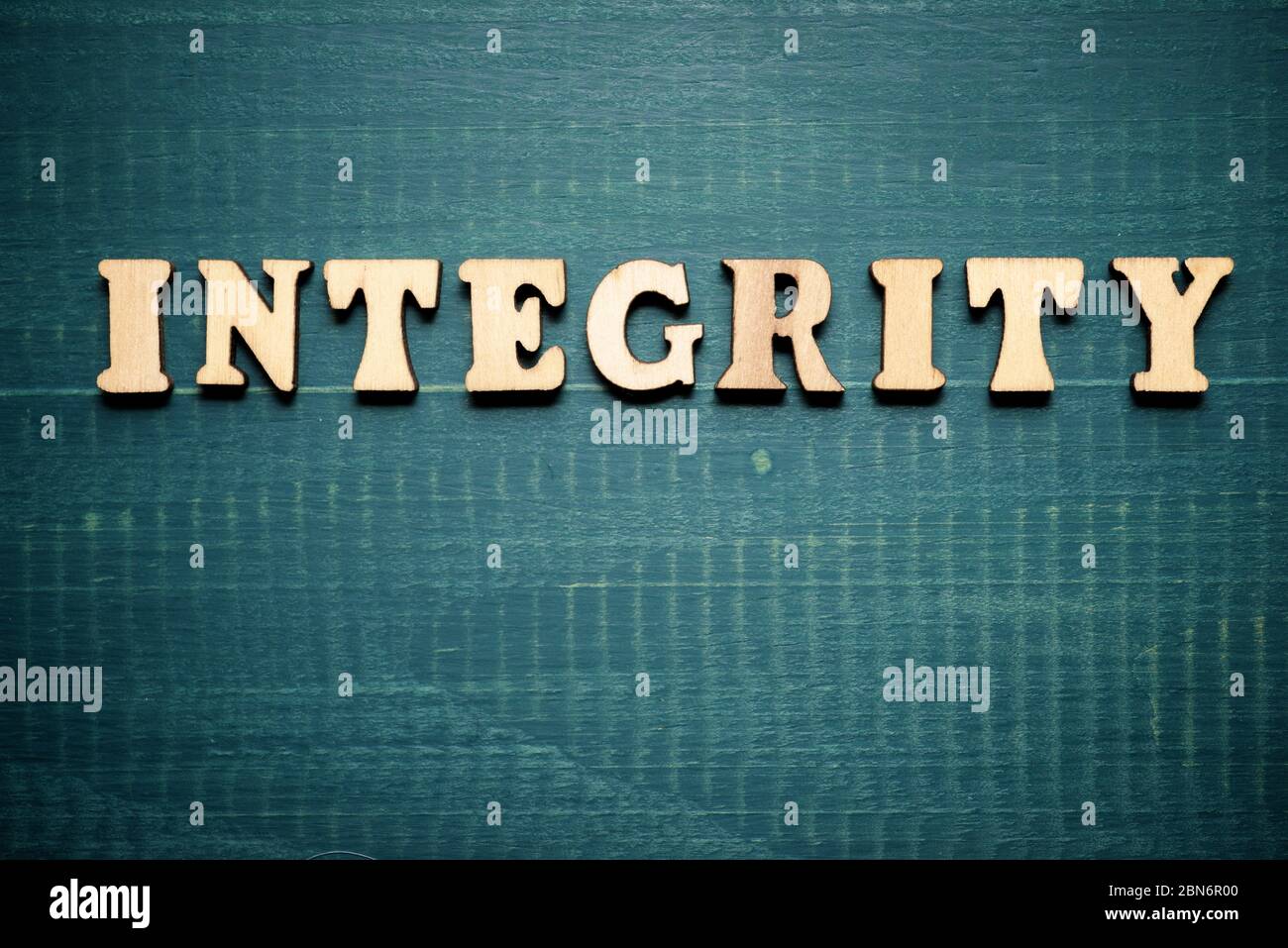 Integrity word on a wood table Stock Photo - Alamy