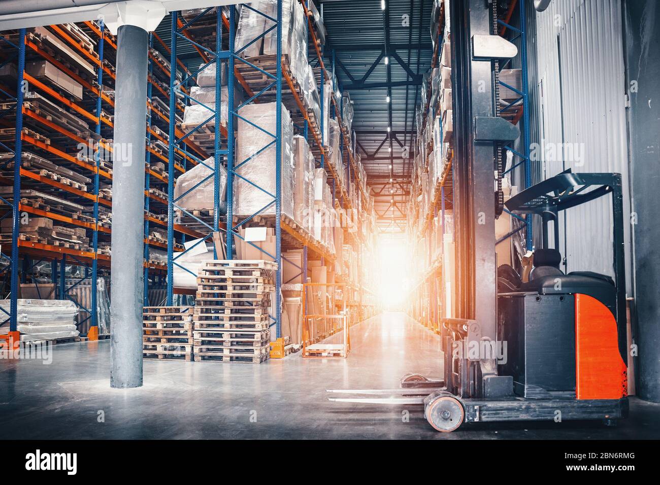 Large Logistics hangar warehouse with lots shelves or racks, pallets of ...