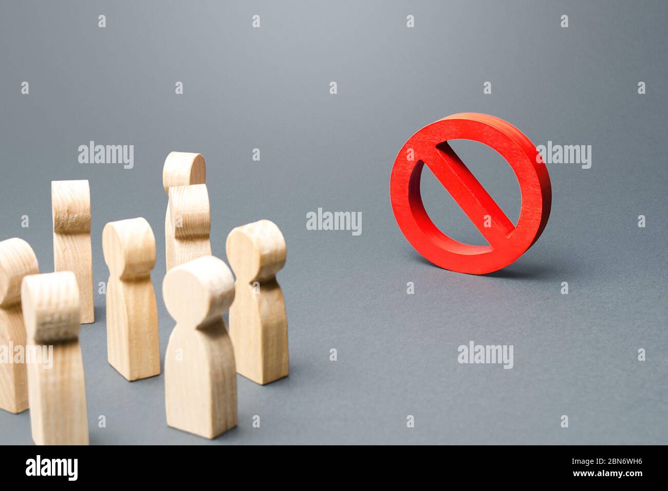 People look at red prohibition sign NO. Restriction of rights and ...