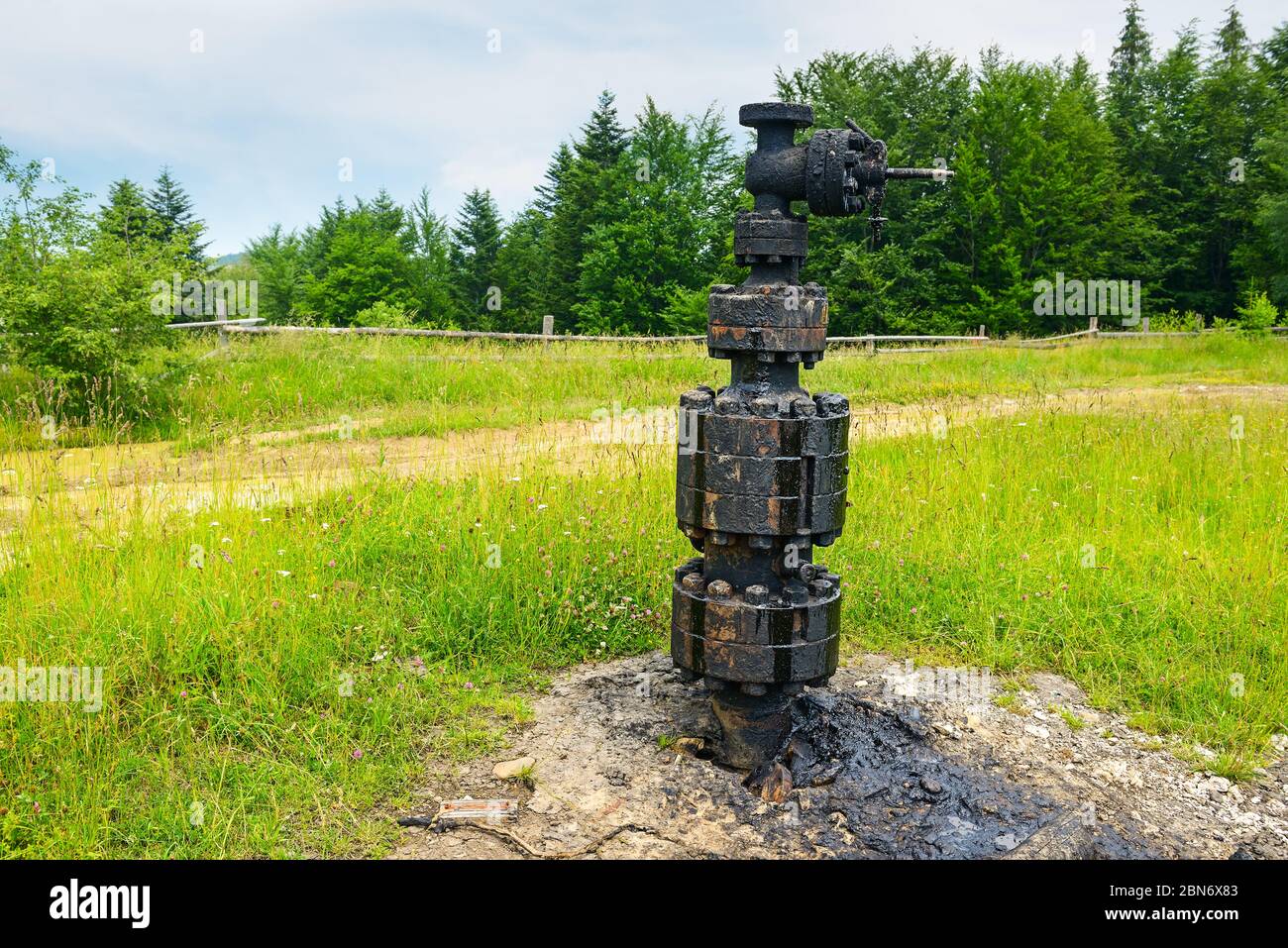Old abandoned borehole in mountains Stock Photo - Alamy