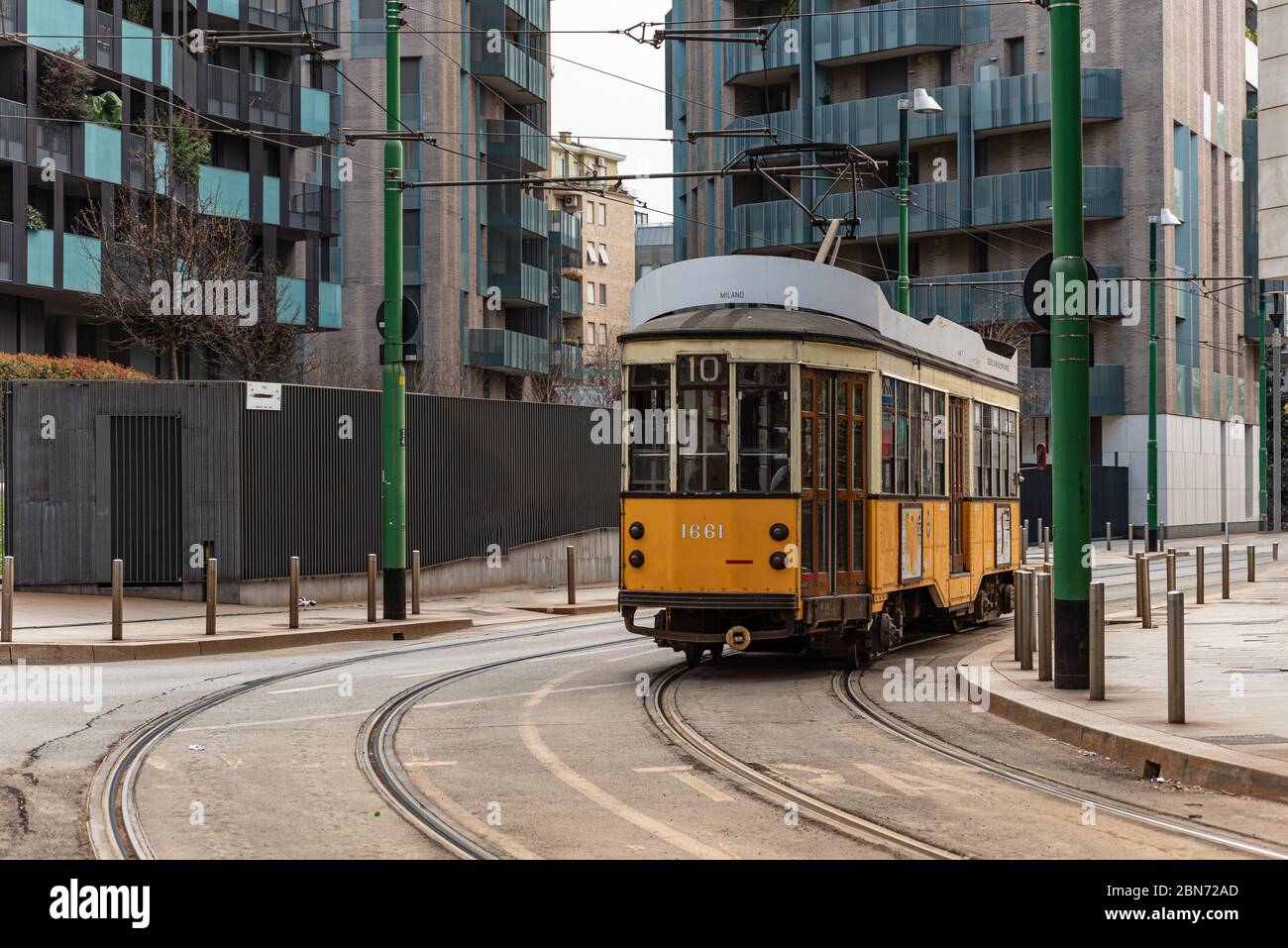 Yellow urban tram runs along the city tracks, street photography Stock ...