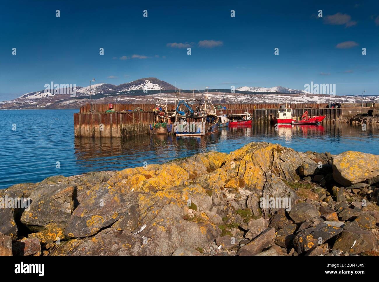 Carradale Harbour and the Isle of Arran, Kintyre, Argyll Stock Photo ...