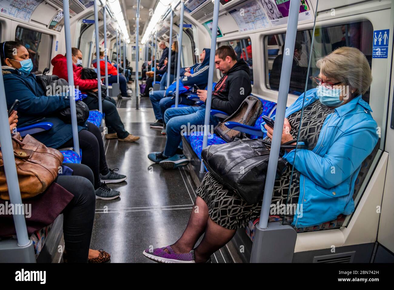 London, UK. 13th May, 2020. A rare, but relatively busy carriage on the ...