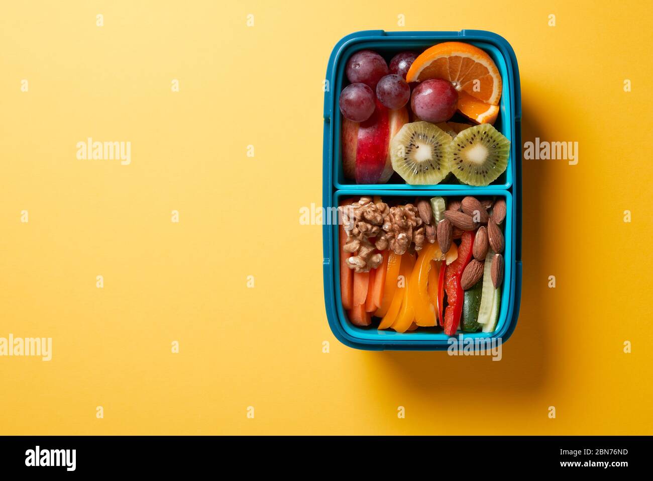 Top View of Full Lunch Box with Fuits, Vegetables and nuts. Healthy ...