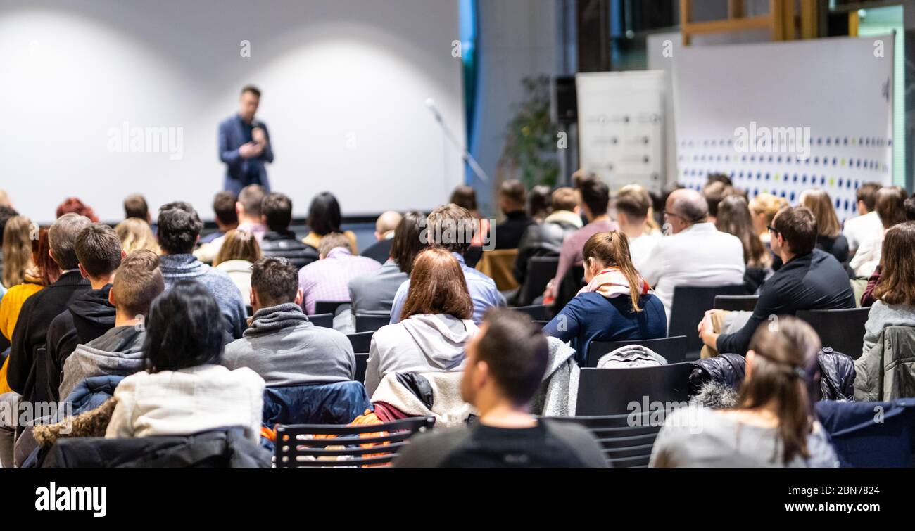 Business speaker giving a talk at business conference event Stock Photo ...