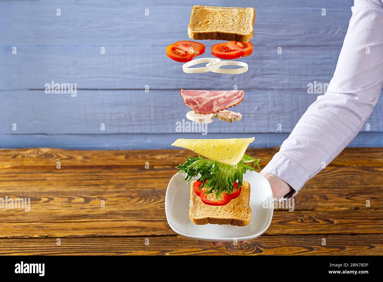 flying sandwich. Flying layers of sandwich. Well roasted patty, Ham ...