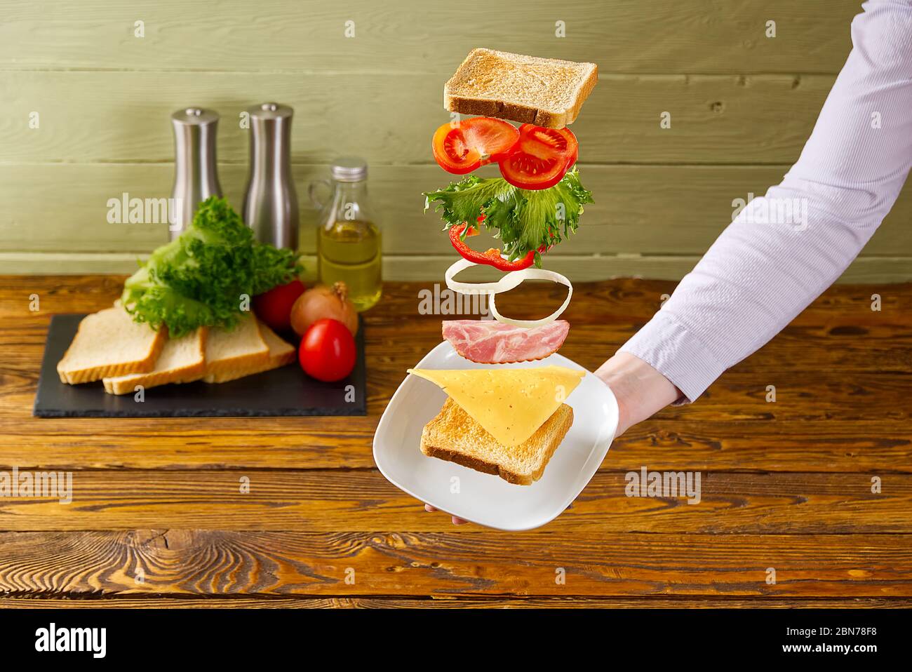 flying sandwich. Flying layers of sandwich. Well roasted patty, Ham ...