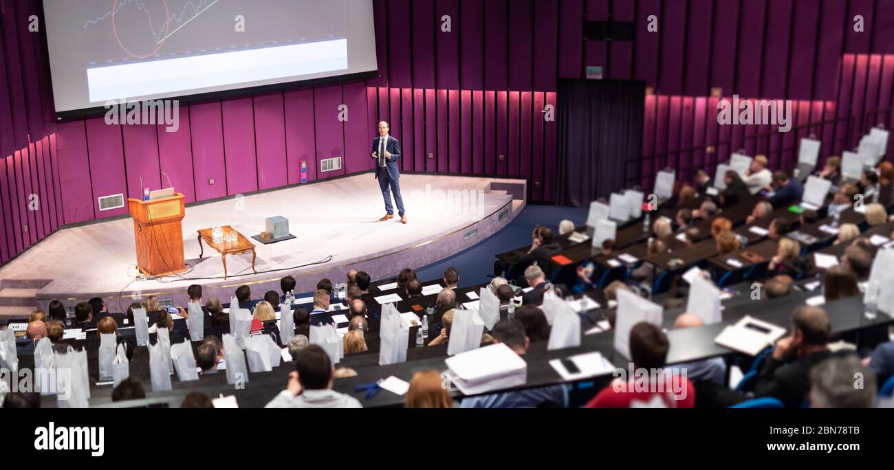 Speaker giving presentation on business conference event Stock Photo ...