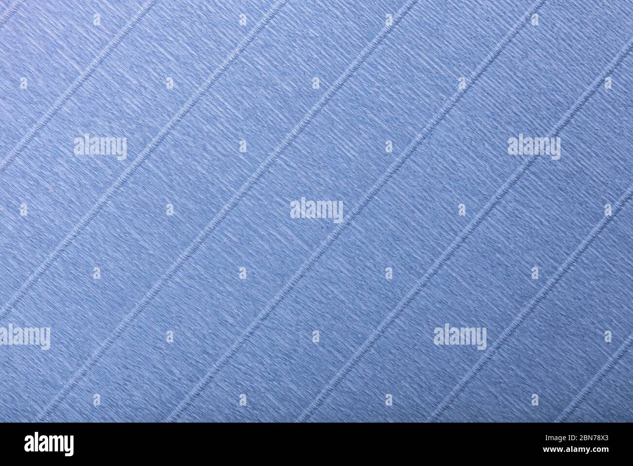 Textural of navy blue background of wavy corrugated paper, closeup ...