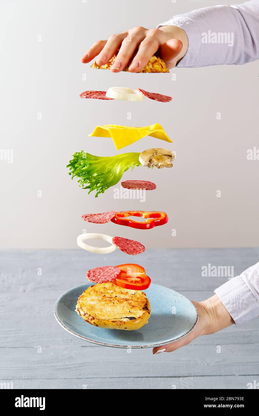 flying sandwich. Flying layers of sandwich. Well roasted patty, Ham ...
