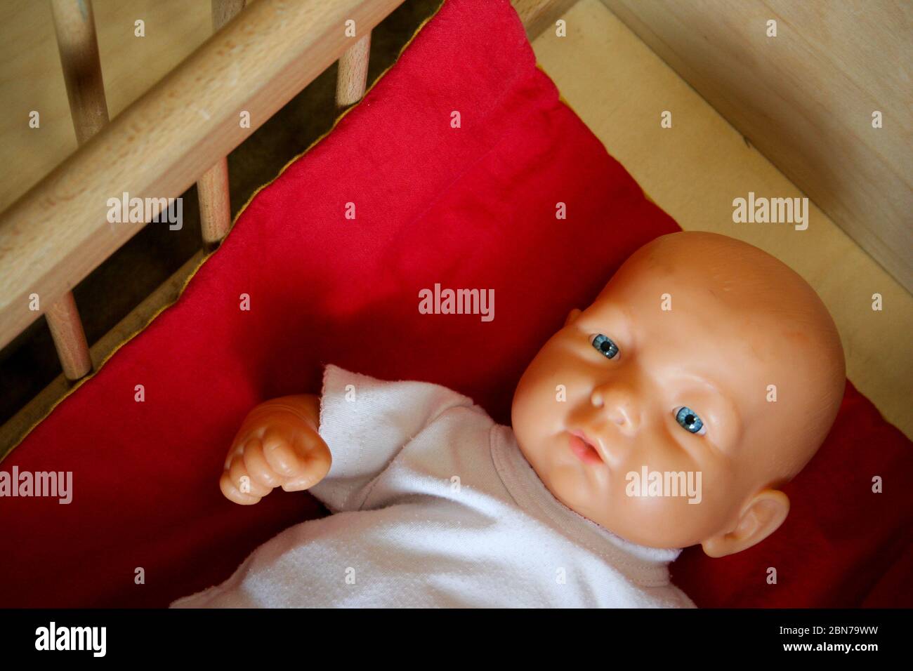 Doll Lying Down in a Crib at a Daycare Stock Photo - Alamy