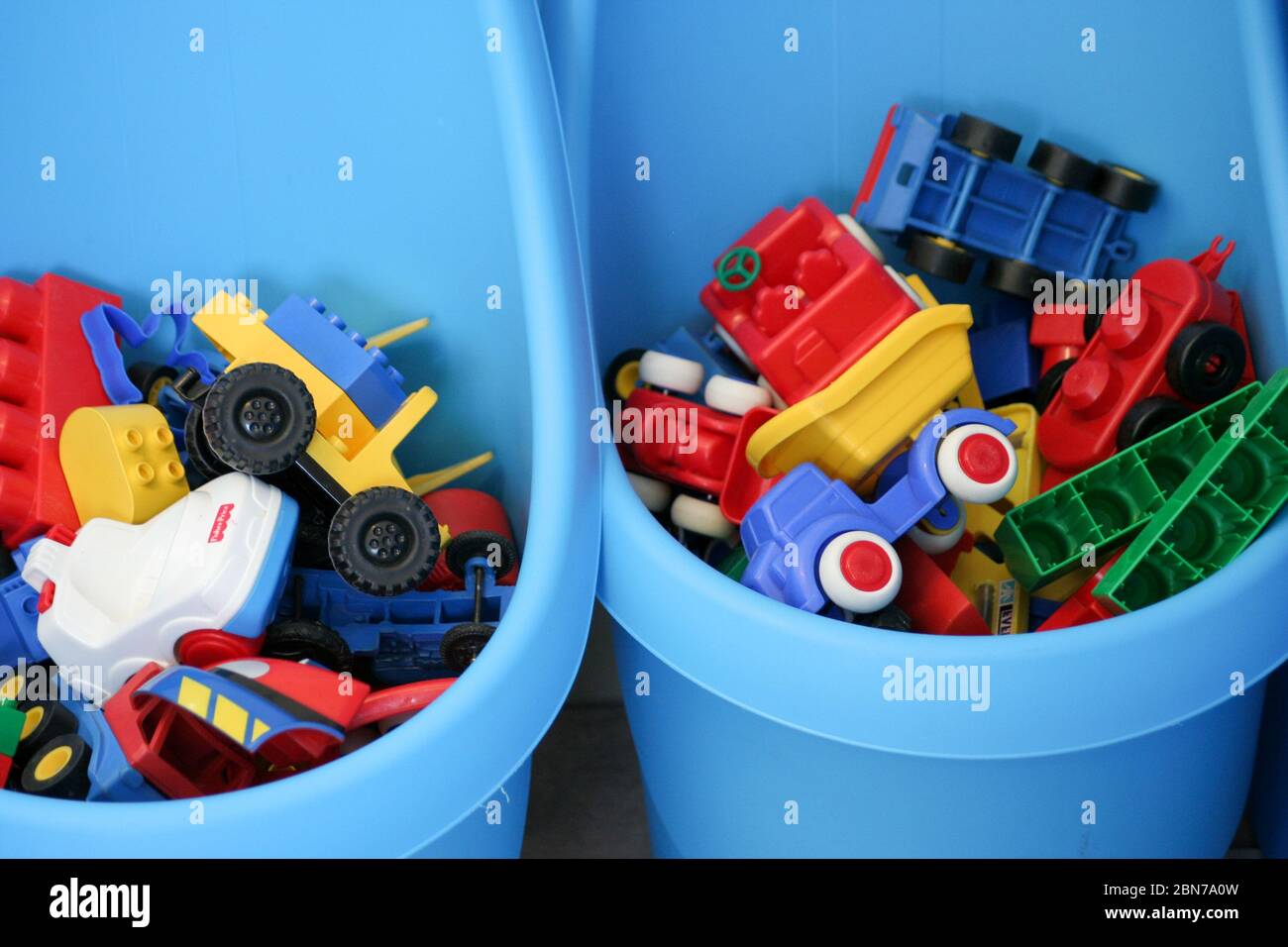 Children's Toys in Blue Bins Stock Photo - Alamy