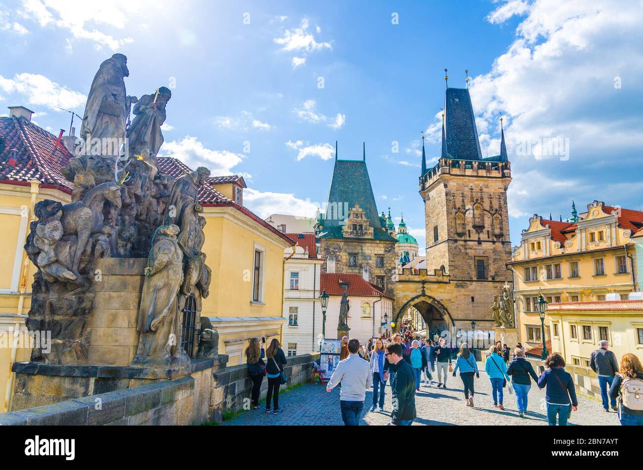 Prague, Czech Republic, May 13, 2019: people are walking down cobblestone pedestrian Charles ...