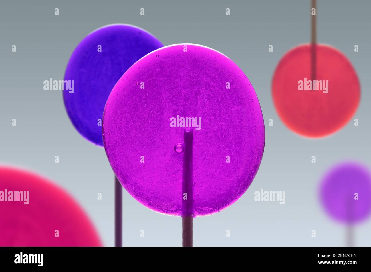 Colorful Sweet Lollipops of Pink, Violet and Red Colors. Round Candies ...