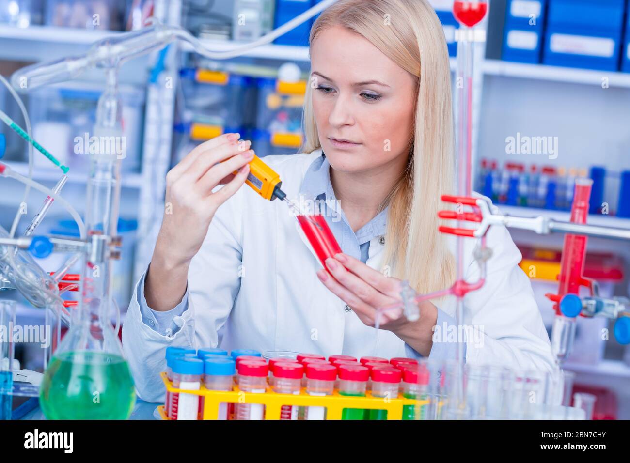 Girl laboratory Assistant works with an antiviral drug in a ...