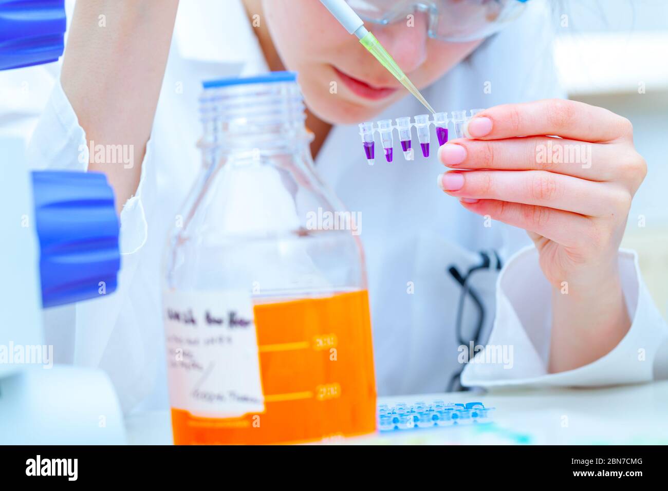Girl laboratory Assistant works with an antiviral drug in a ...
