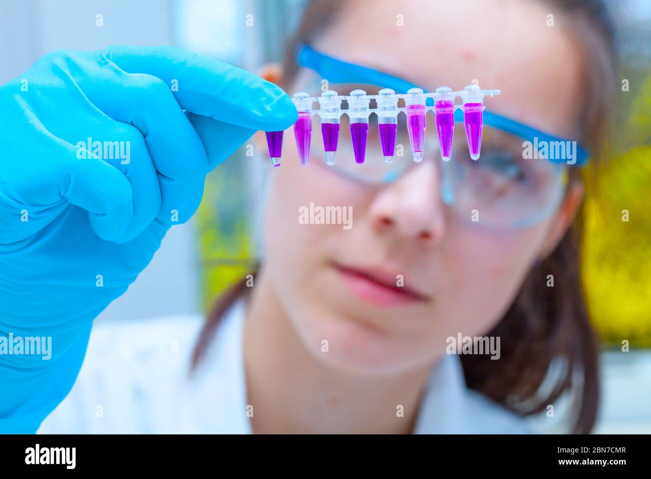 Girl laboratory Assistant works with an antiviral drug in a ...