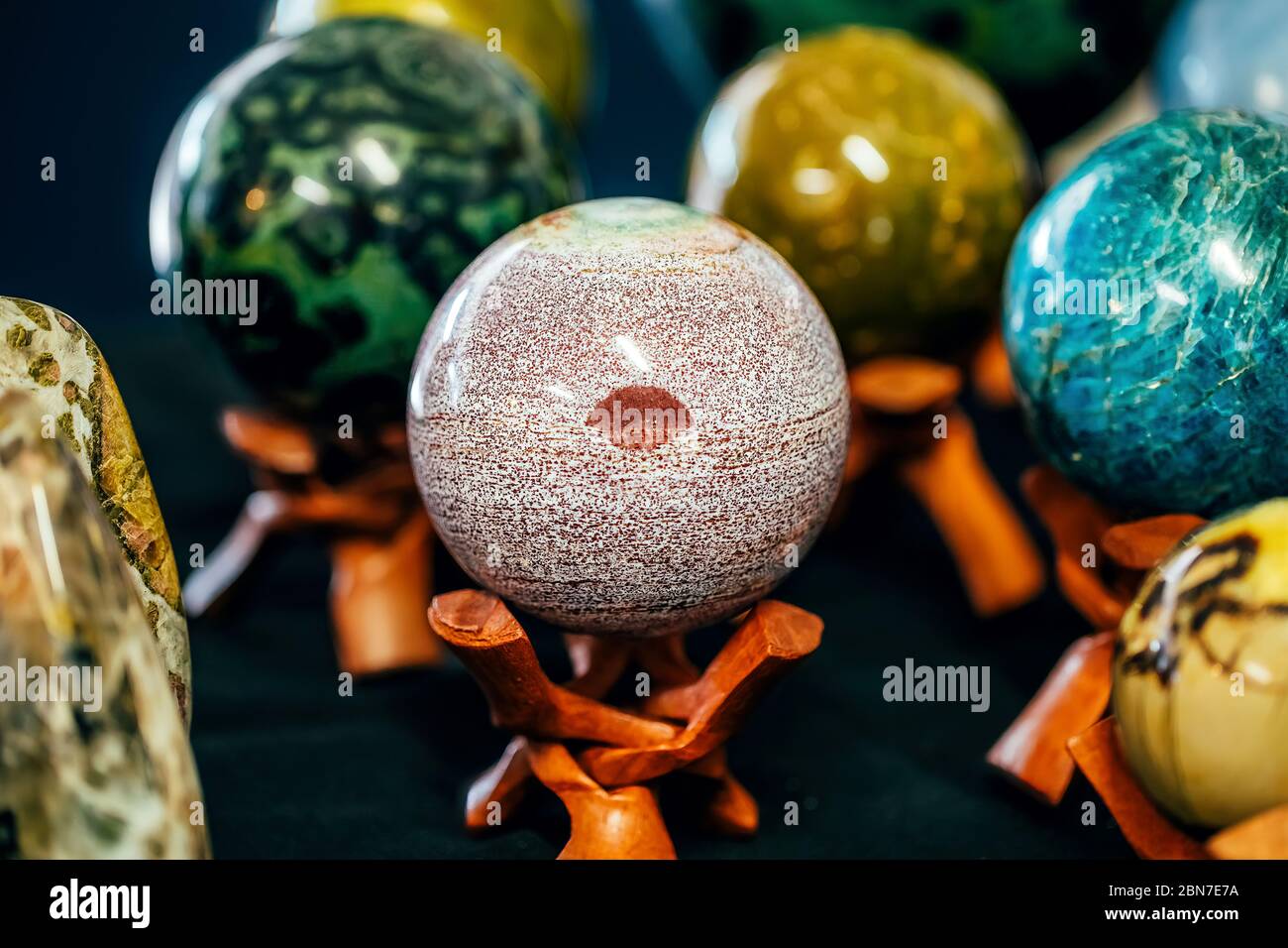 Stone in Sphere shape with a mark like lips on the stand. Various ...