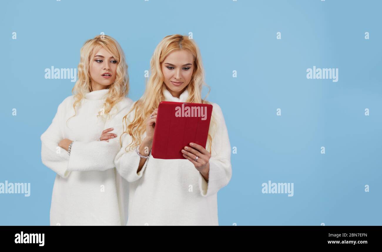 Online shopping. Young female models remotely shop in an online store ...