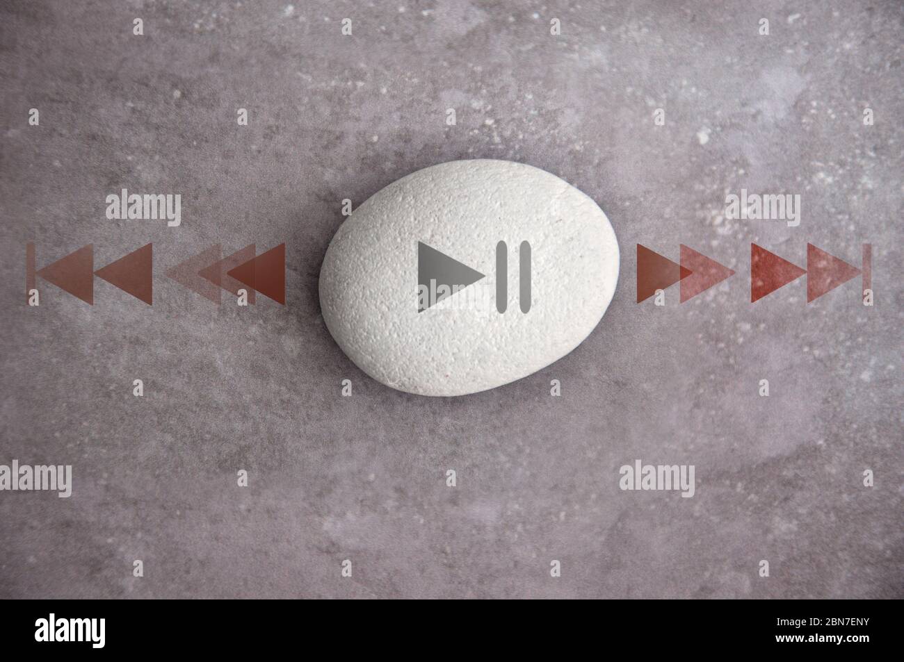 Mindfulness zen stone with pause symbol, and moving fast forward ...