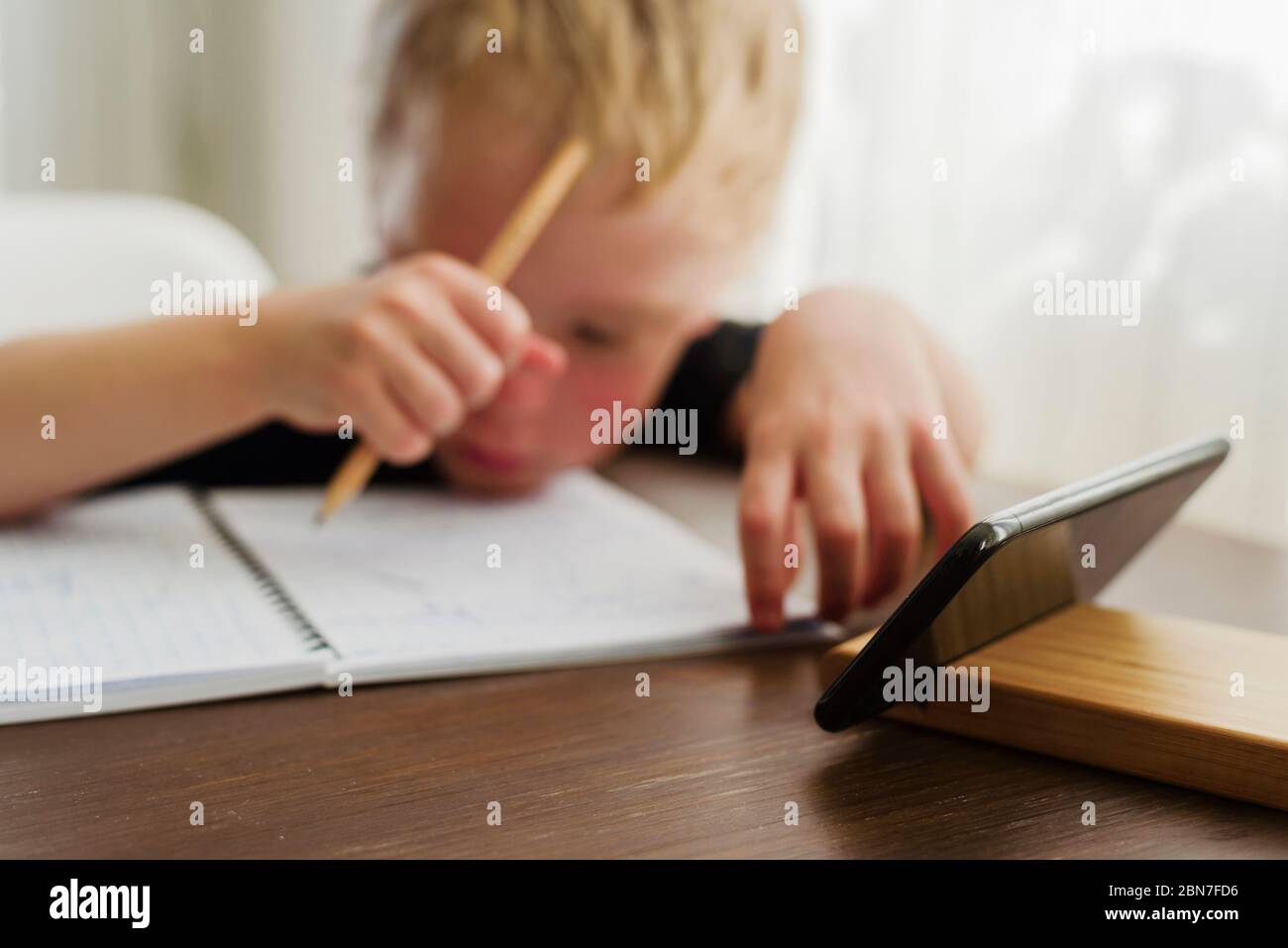 Child writing classroom sad hi-res stock photography and images - Alamy