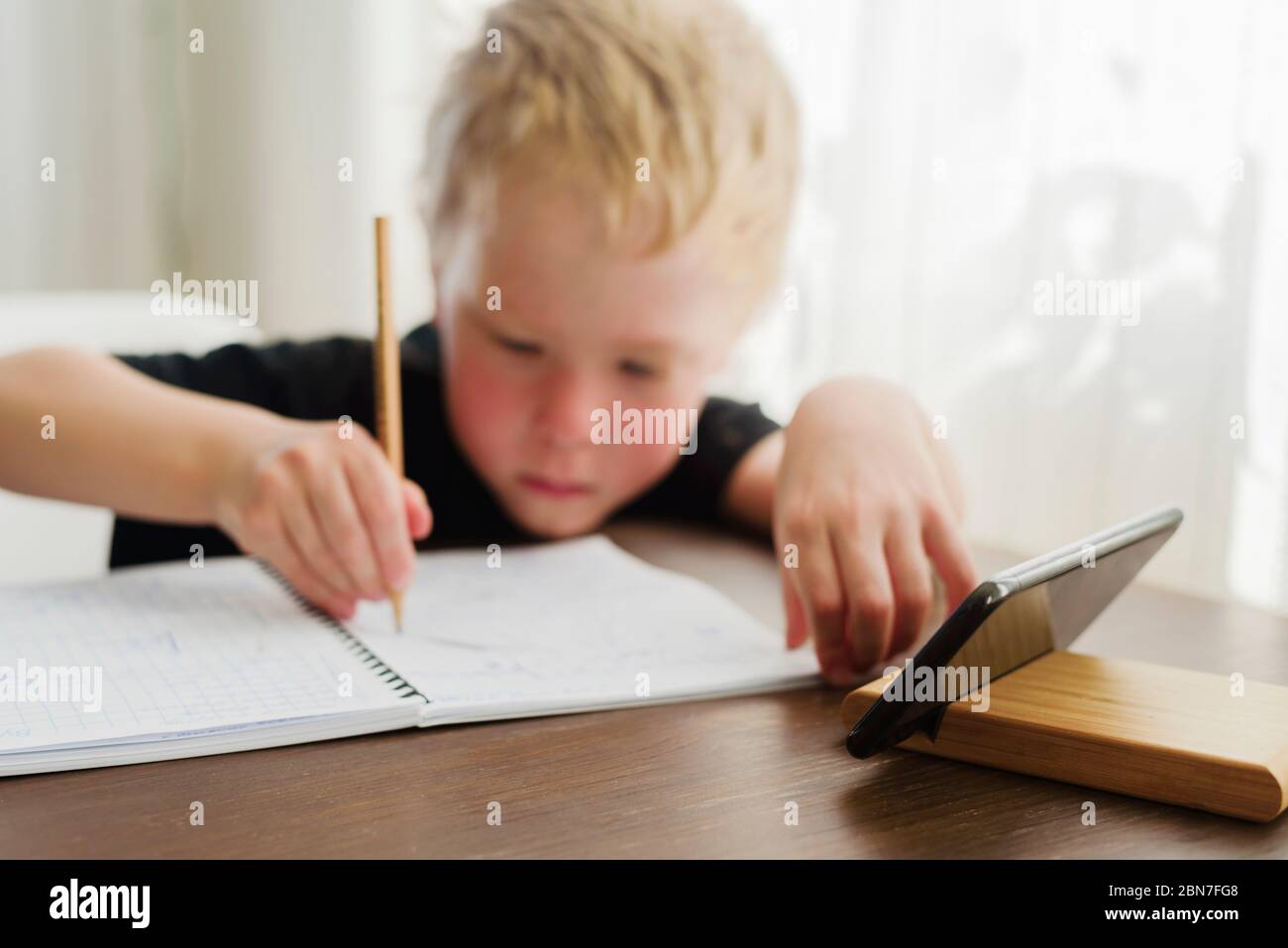 Sad kid in classroom hi-res stock photography and images - Alamy