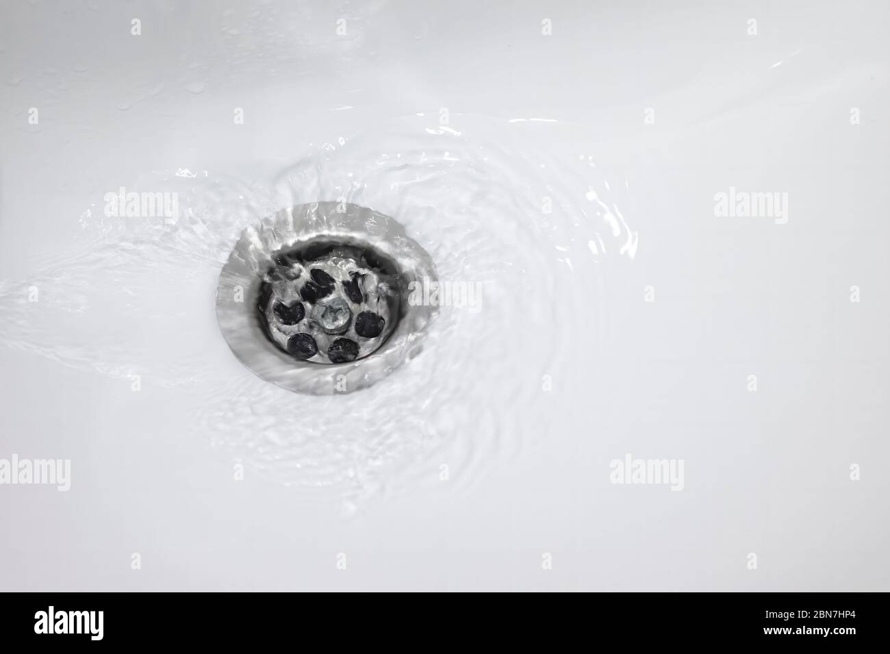 water flow into drain in bath Stock Photo - Alamy