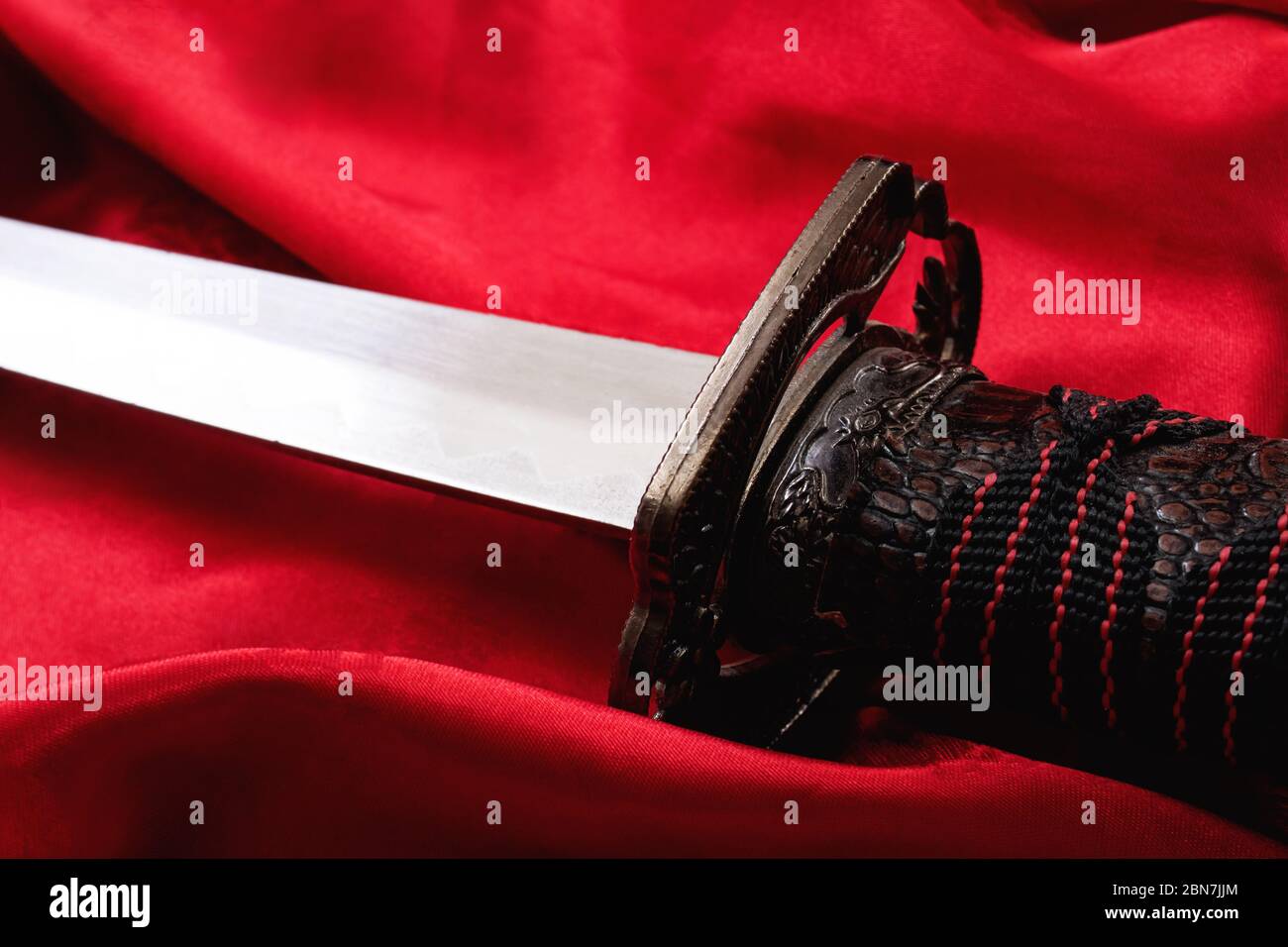 Samurai sword on the red cloth closeup Stock Photo - Alamy