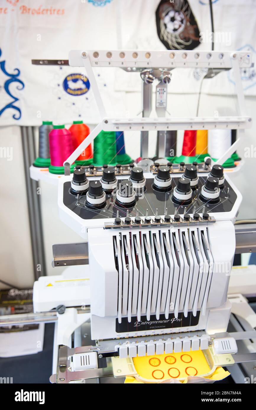 Embroidery Machine wirh Multicolored Threads on Exhibition Stand Stock ...