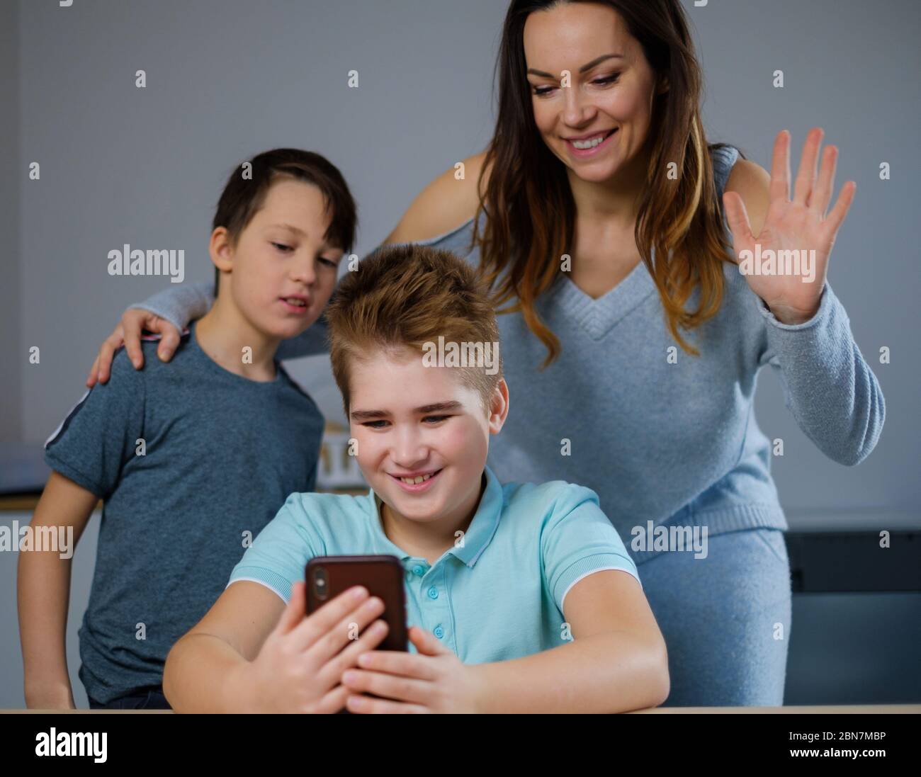 Happy family making a video call Stock Photo - Alamy