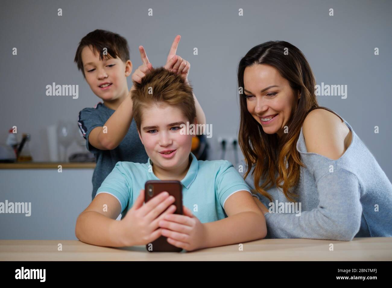 Happy family making a video call Stock Photo - Alamy