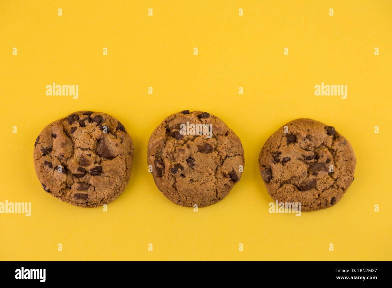 cookies biscuits on yellow background Stock Photo - Alamy