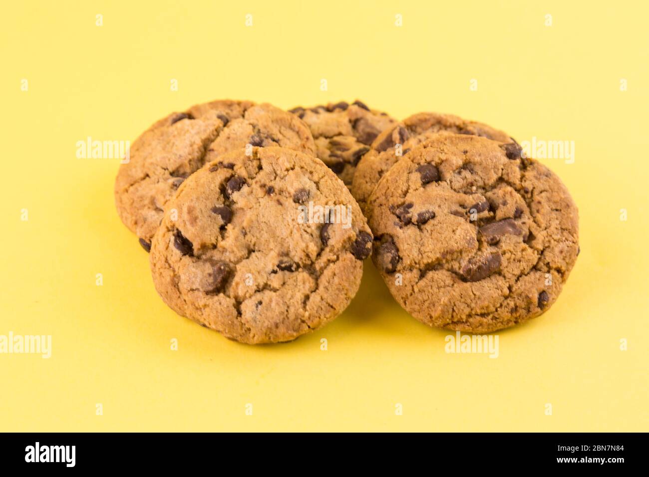 cookies biscuits on yellow background Stock Photo - Alamy