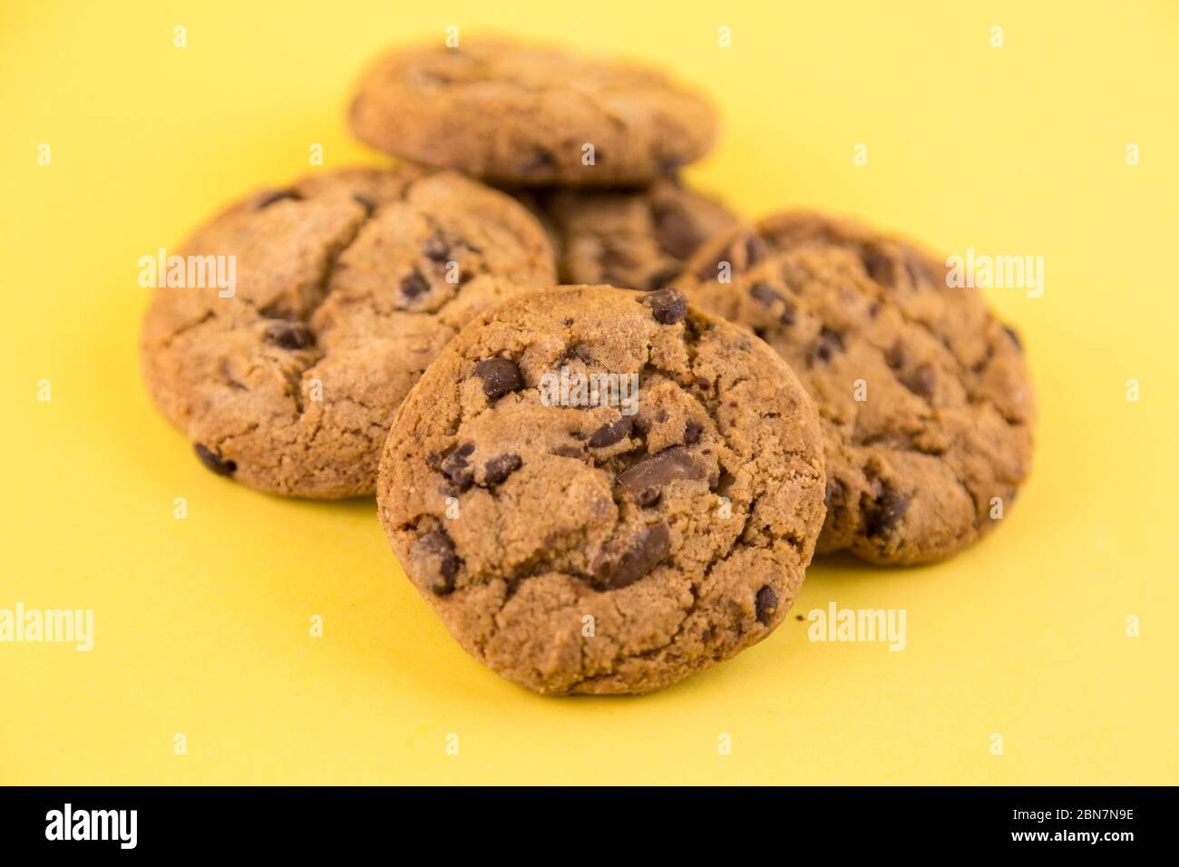 cookies biscuits on yellow background Stock Photo - Alamy