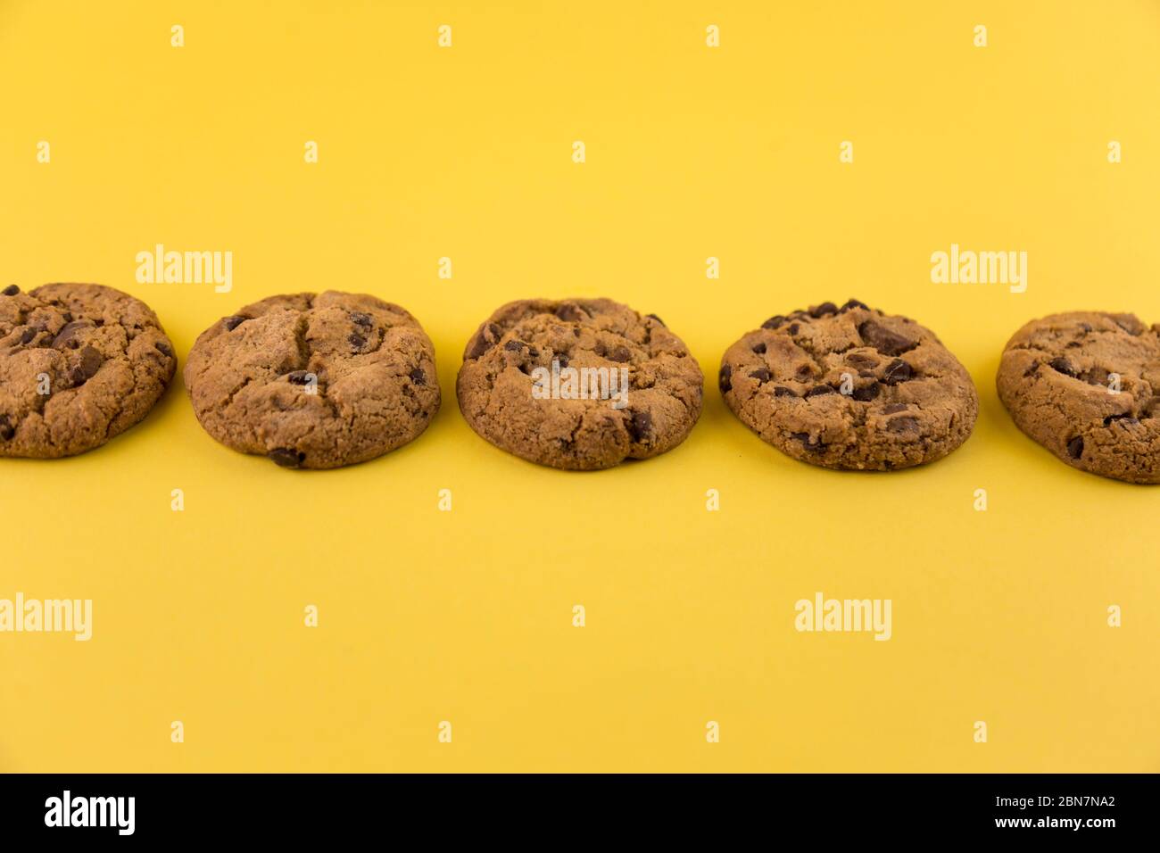 cookies biscuits on yellow background Stock Photo - Alamy