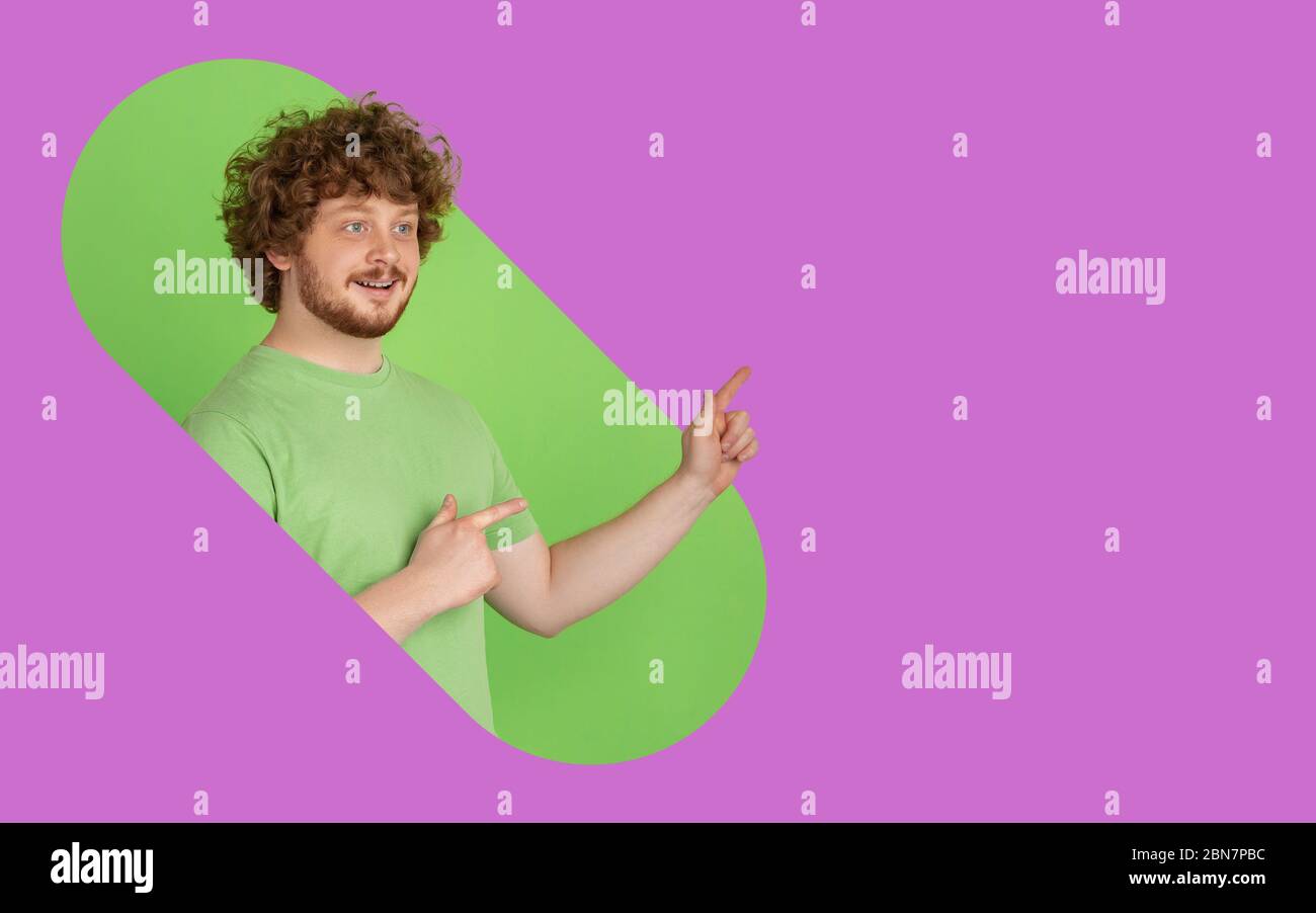 Portrait of young man on bright bicolor background. Beautiful caucasian ...
