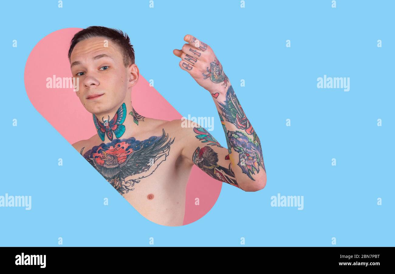 Portrait of young man on bright bicolor background. Unusual freaky look ...