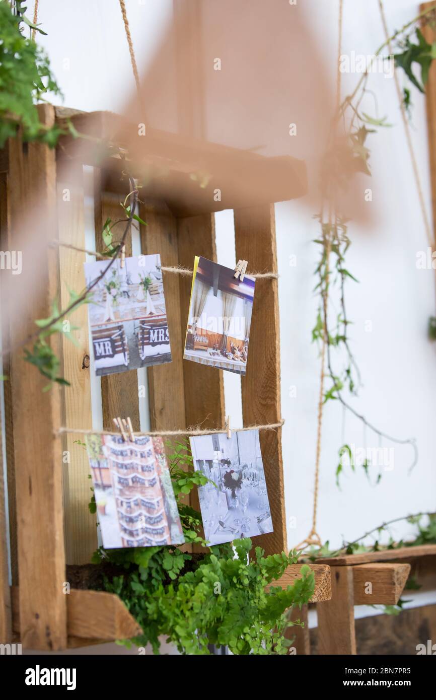 Suspended Wood Pallet and Crates Decorated with Rope and Wedding Photos ...