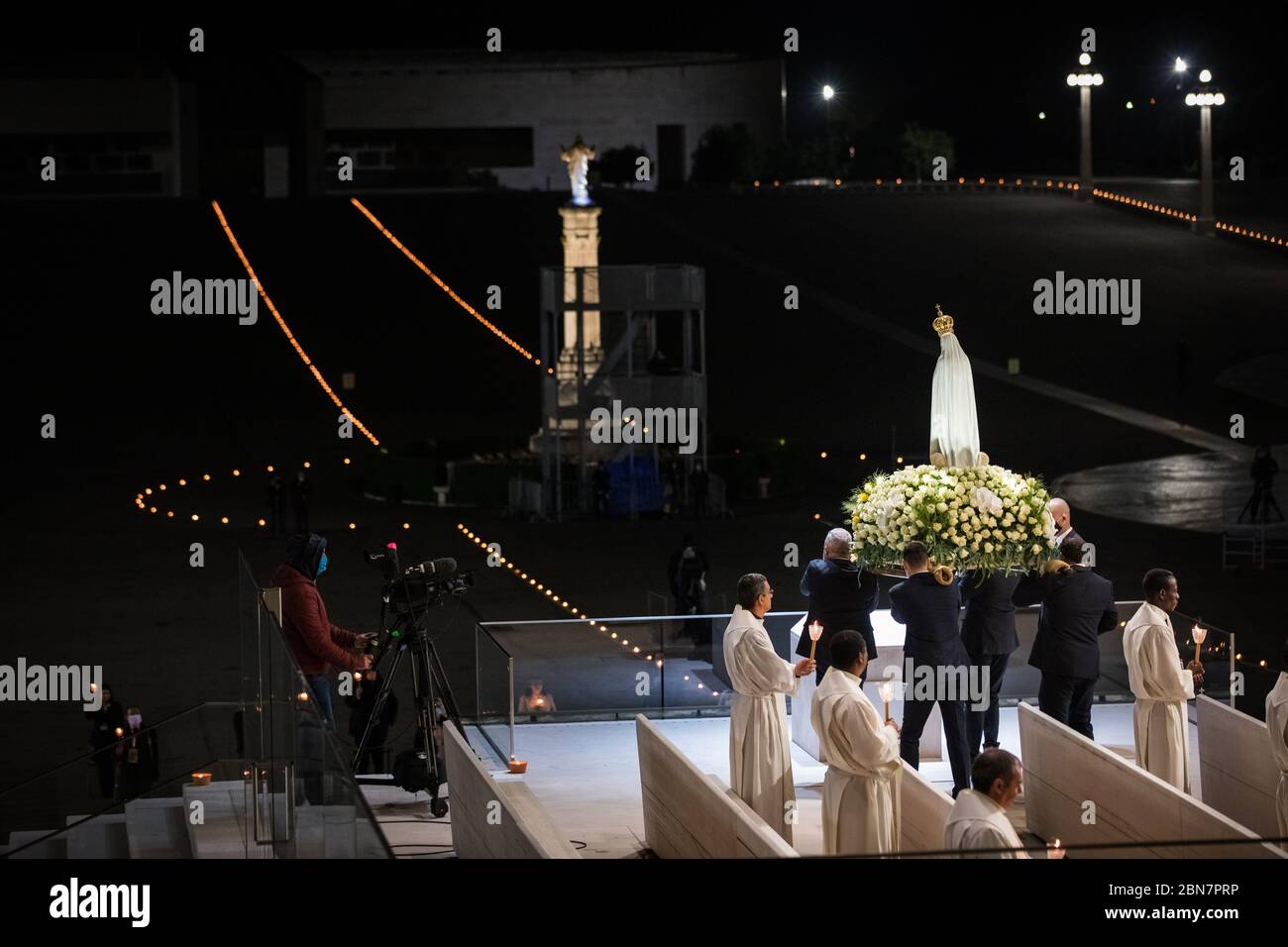 Christians carry an image of Our Lady of Fatima to the altar during the ...